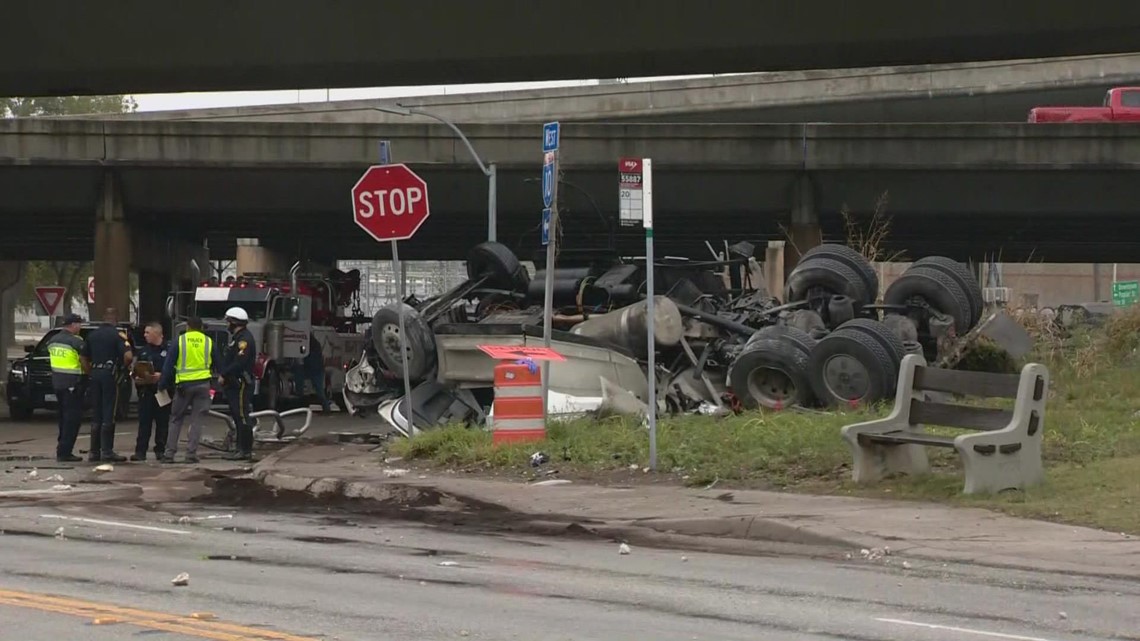 18-wheeler crashes off highway, lands on lower level 13 feet below ...