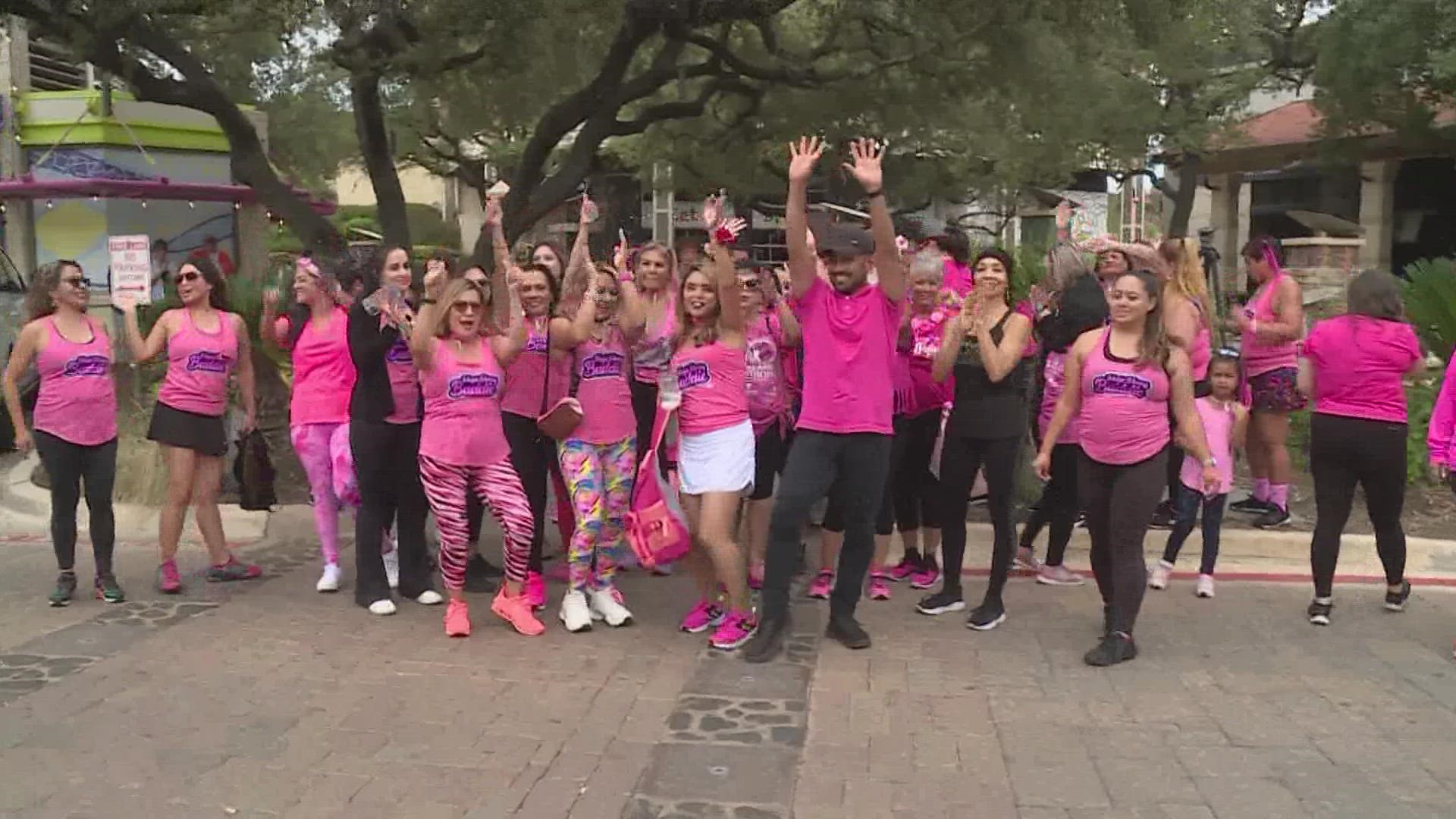 Dozens of women dressed in pink danced for Cancer Awareness Month ...