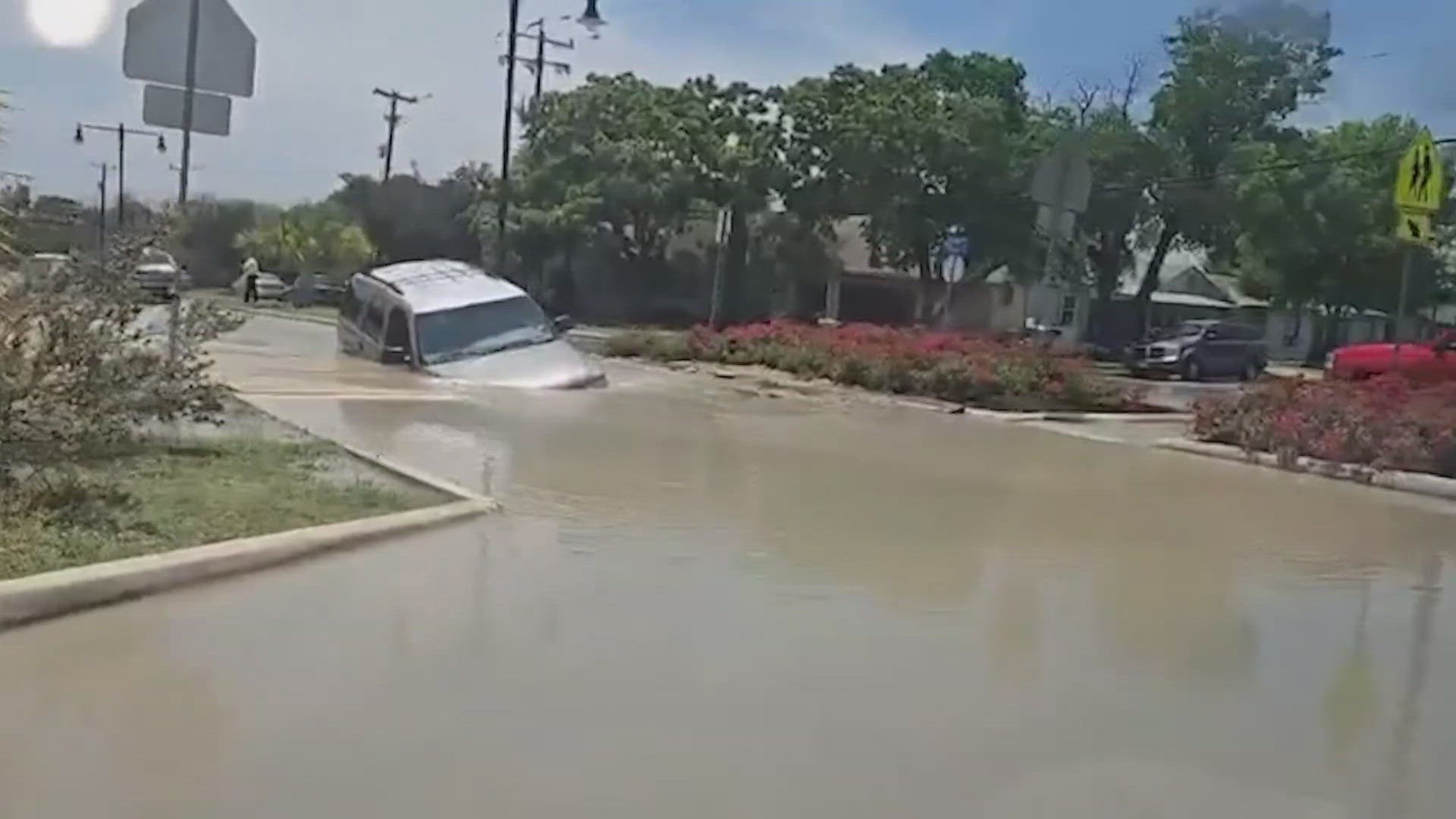 SUV stuck in road hole after water main break near Jefferson High ...