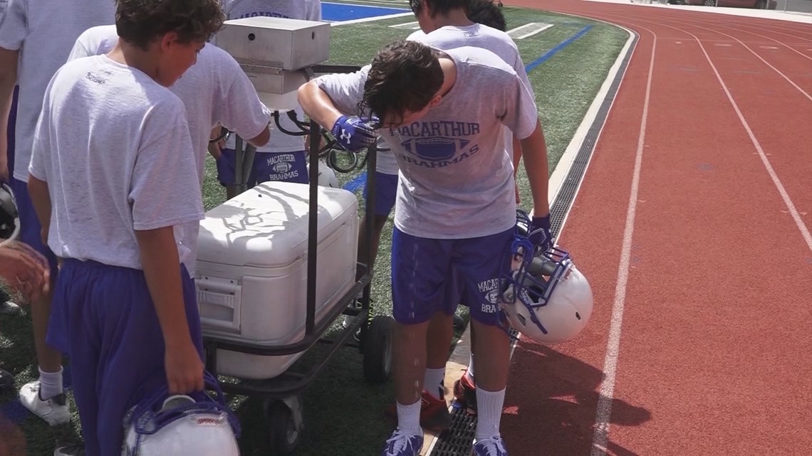 Two-a-days begin for high school football in extreme heat | kens5.com
