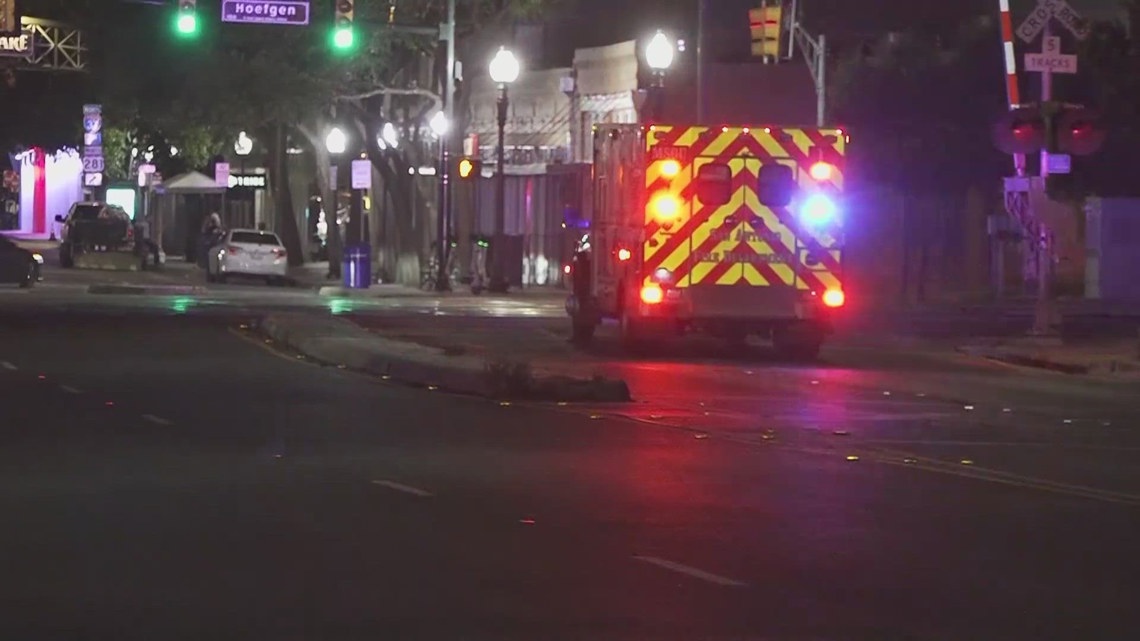 Woman hospitalized after being caught in crossfire of shooting outside ...