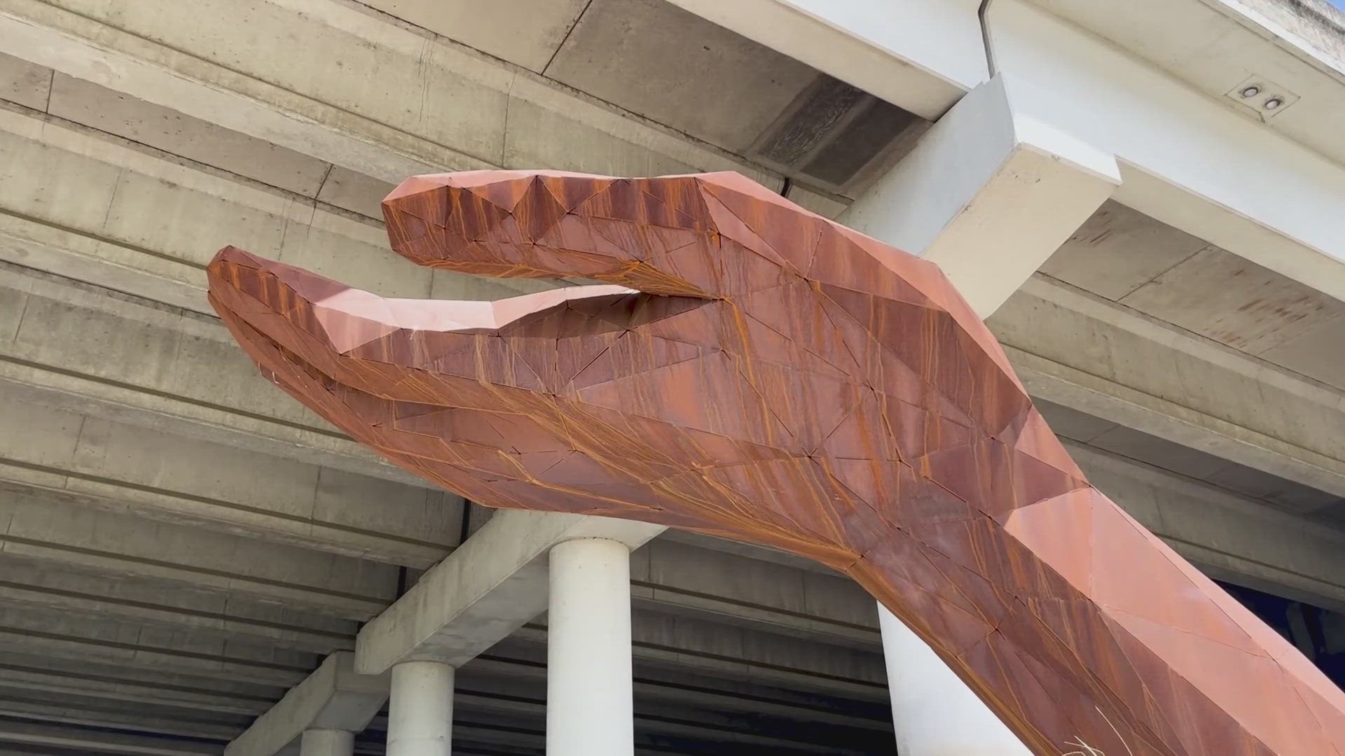New giant hand sculpture engineered to help keep San Antonio waterways ...