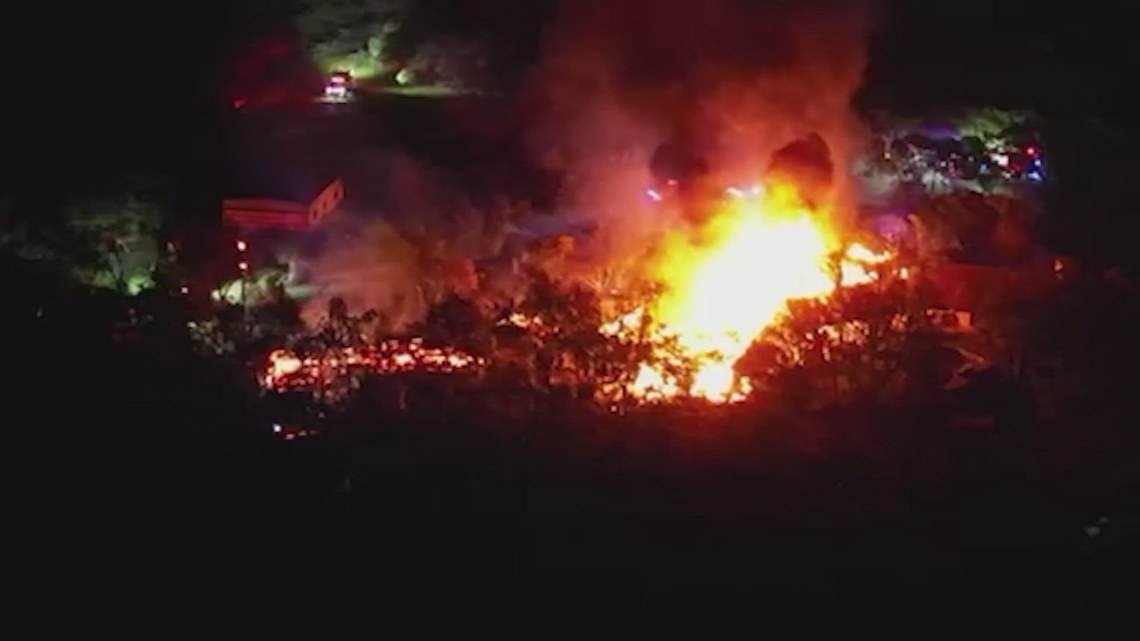 SAFD: Vacant buildings go up in flames after grass fire spreads off ...