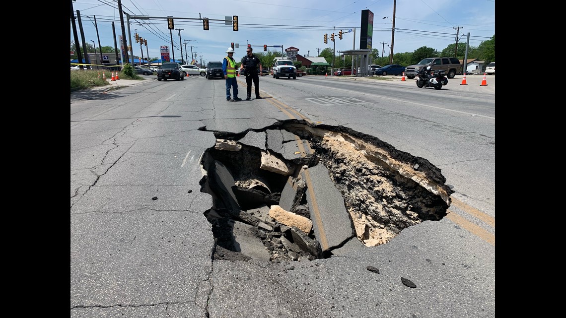 After large sinkhole on west side prompts road closure, pipe now ...