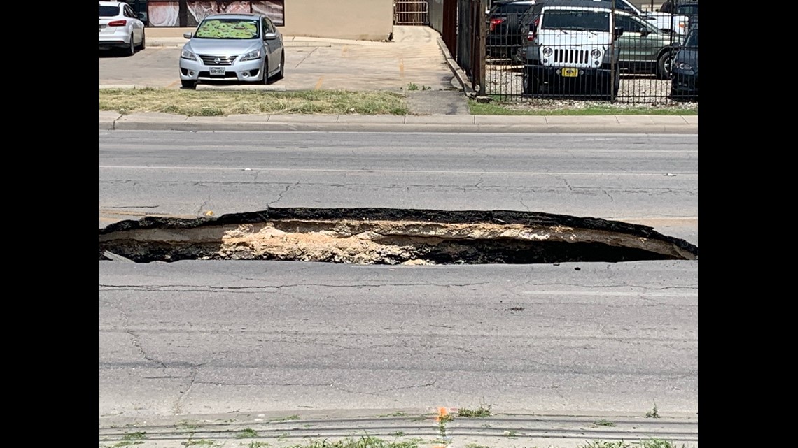 After large sinkhole on west side prompts road closure, pipe now ...