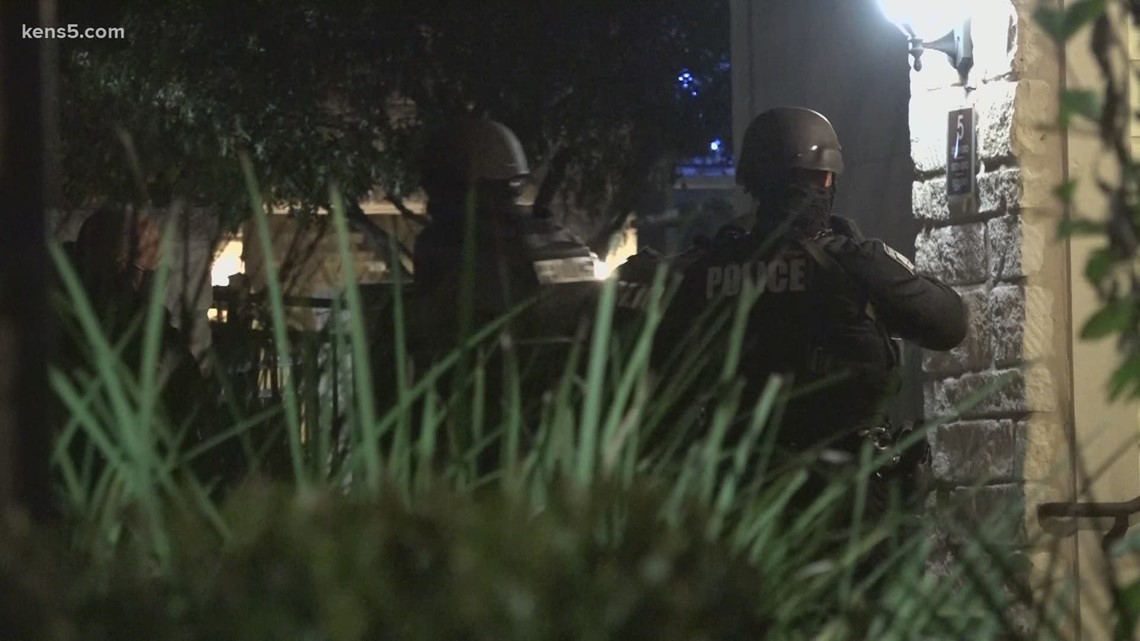 SWAT units enter apartment searching for suspect; find drugs and ...