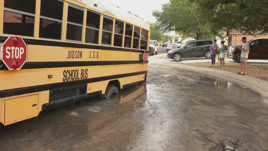 Part of Judson ISD school bus collapses into street, water main break ...