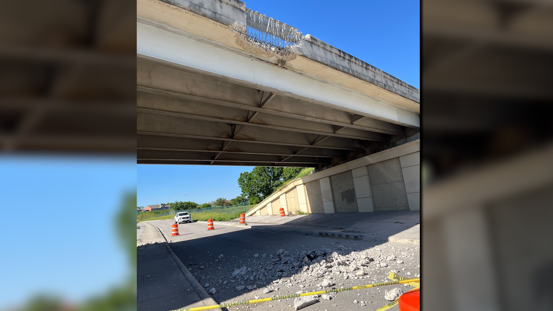 Crumbling highway wall debris narrowly misses pedestrian. Here's what ...