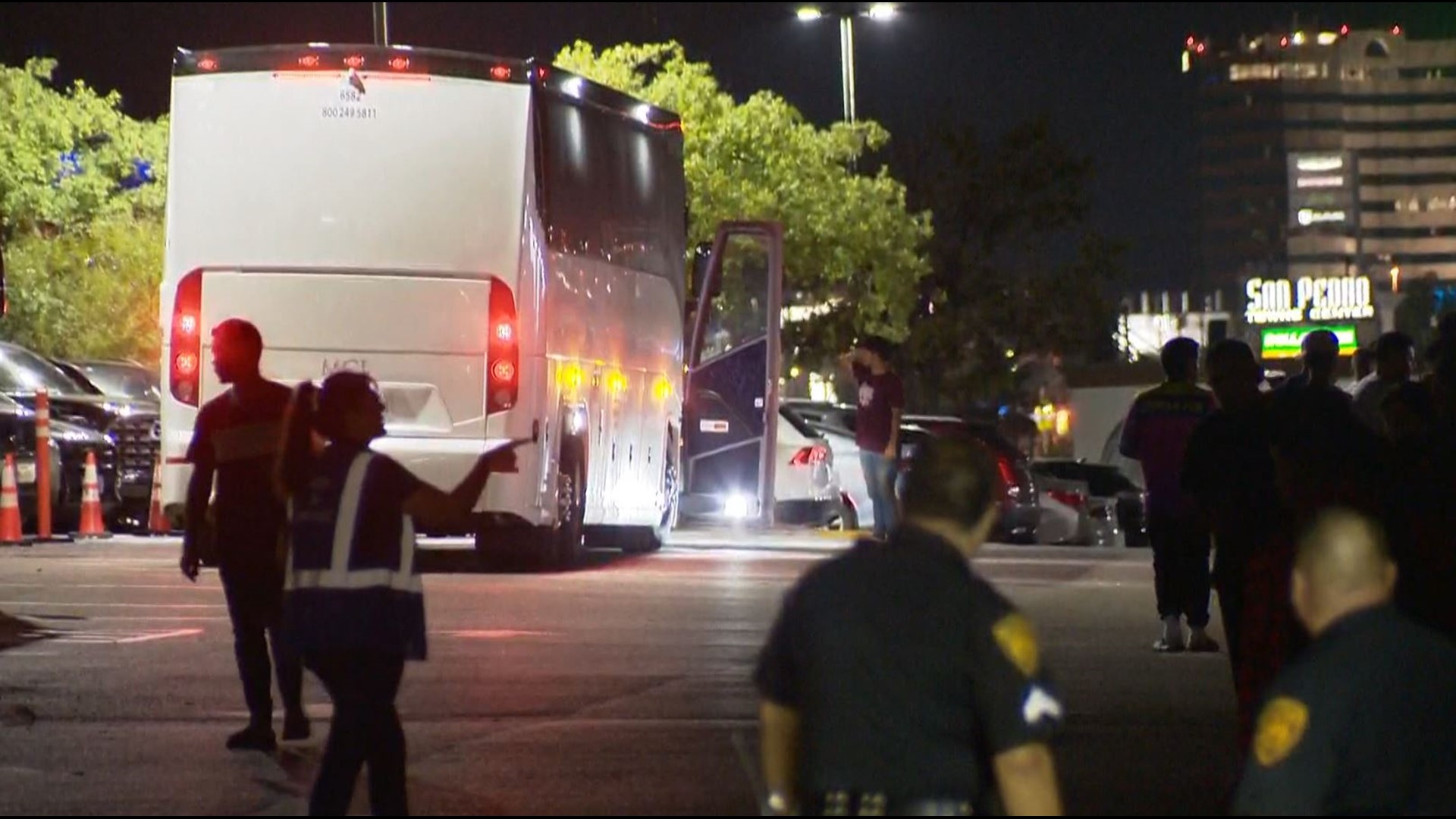 Migrants sleep in the streets early Thursday morning as resource center ...