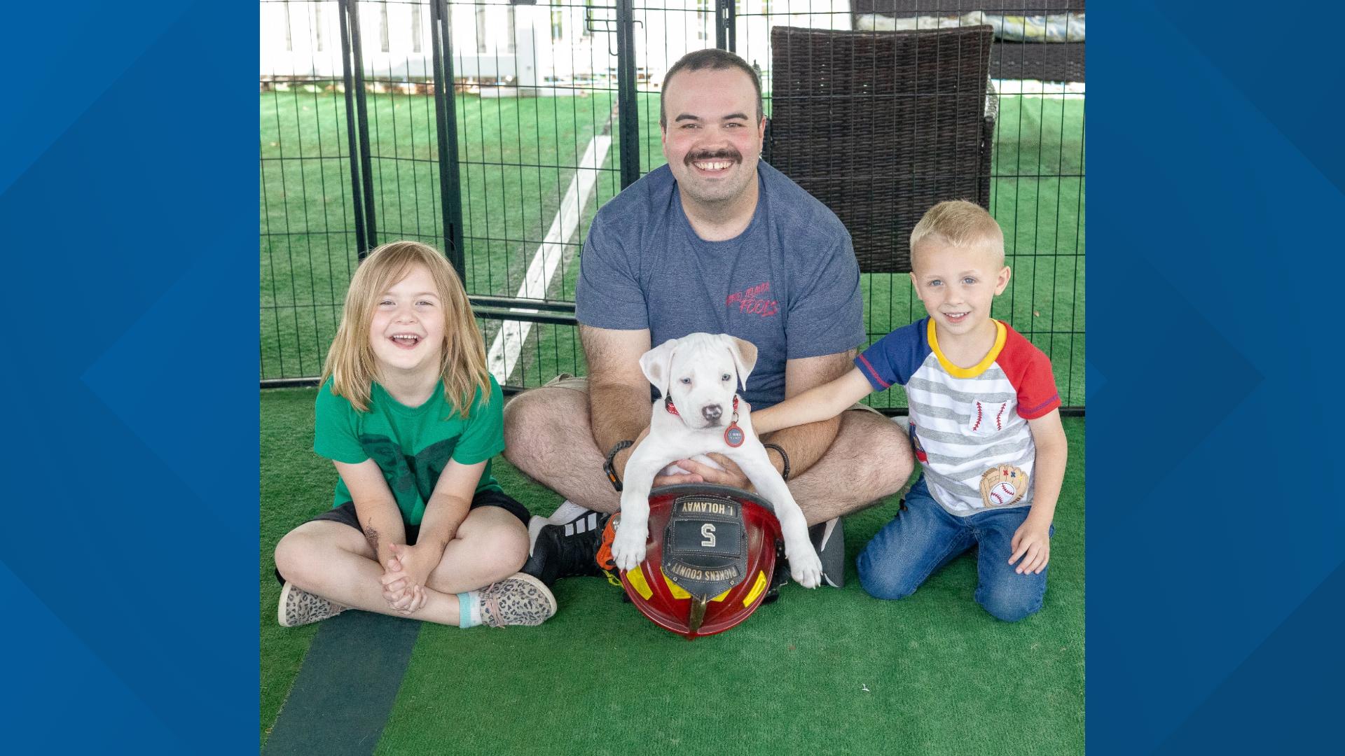 A puppy pulled from a house fire finds family again with the ...